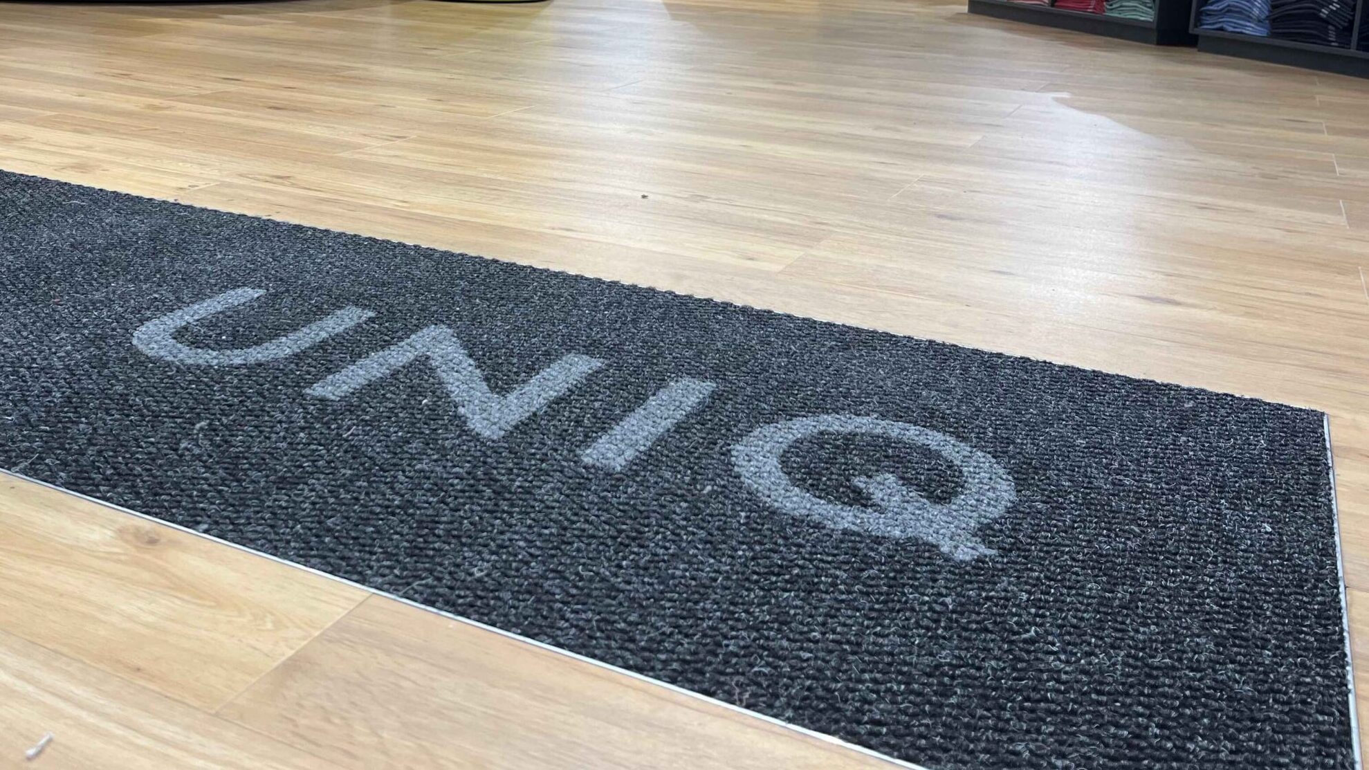 Spectra Clean: Logo Mat solution for UNIQE Clothing